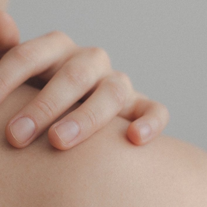 hand on shoulder - British Association for Holistic Medicine & Health Care